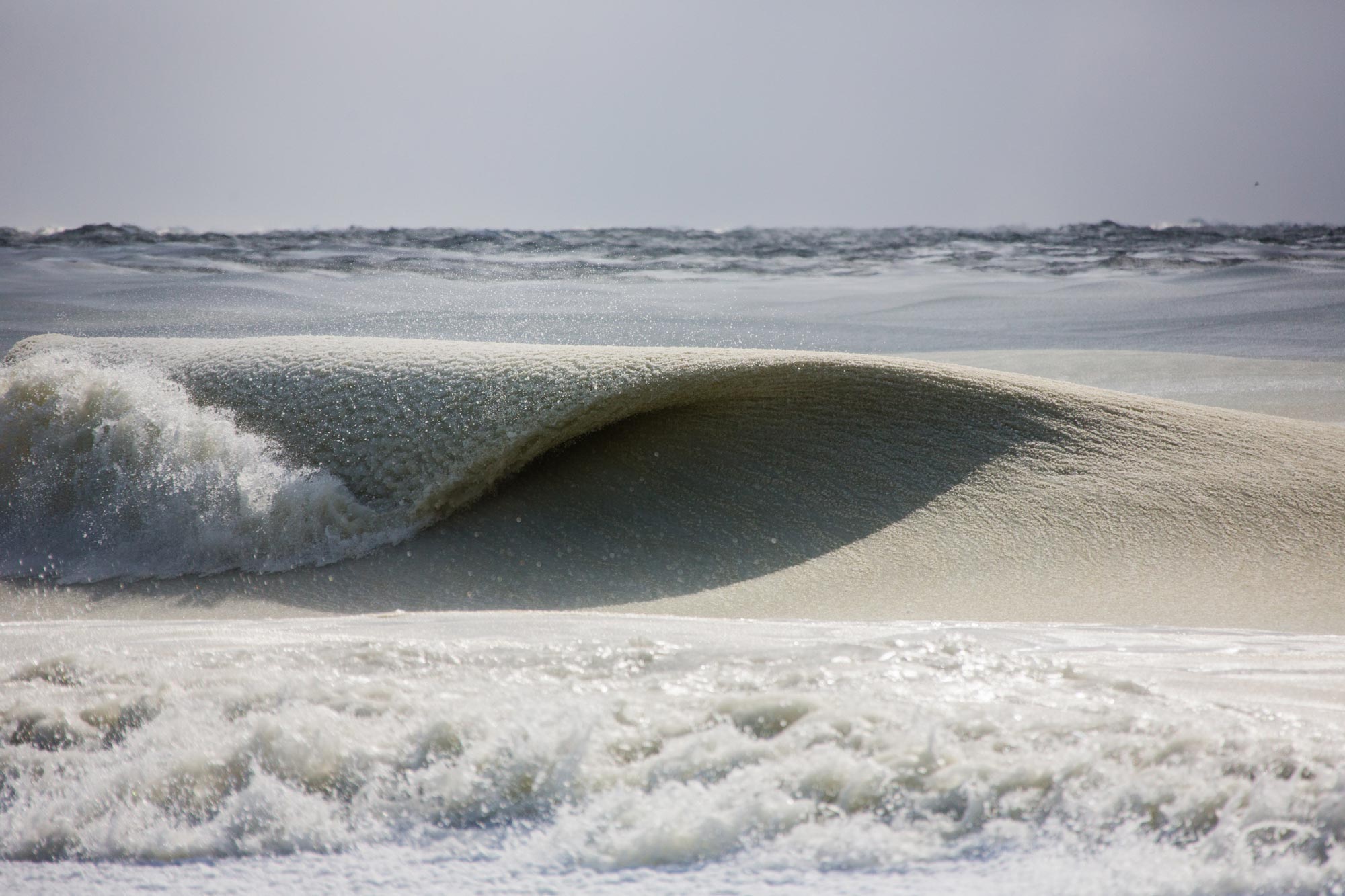Slurpee waves: Incredible photos capture nearly frozen waves off the ... Slurpee waves: Incredible photos capture nearly frozen waves off the ...